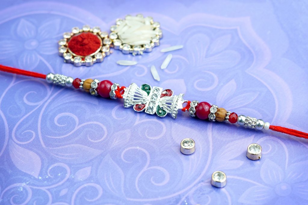 Damru Red Pearl Rakhi - ChhappanBhog